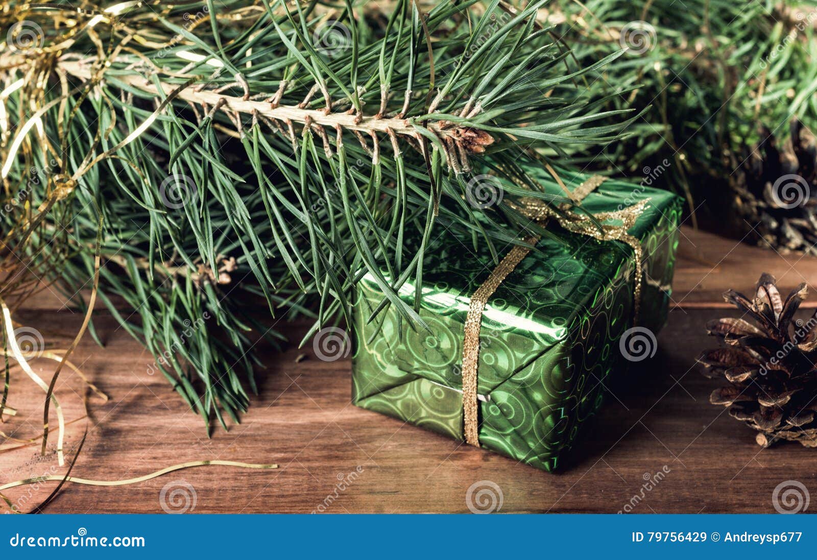 Green Gift Box Under Christmas Tree Branches Stock Image - Image of ...