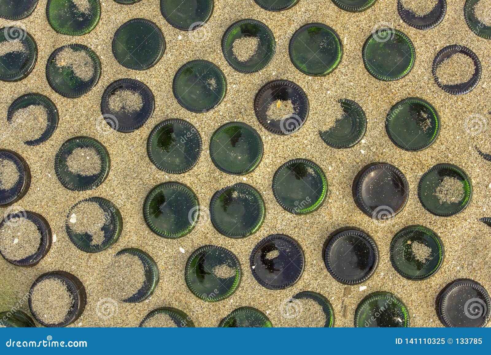 Green Glass Bottles Protrude from the Sand a Round Bottom Up. Rough ...