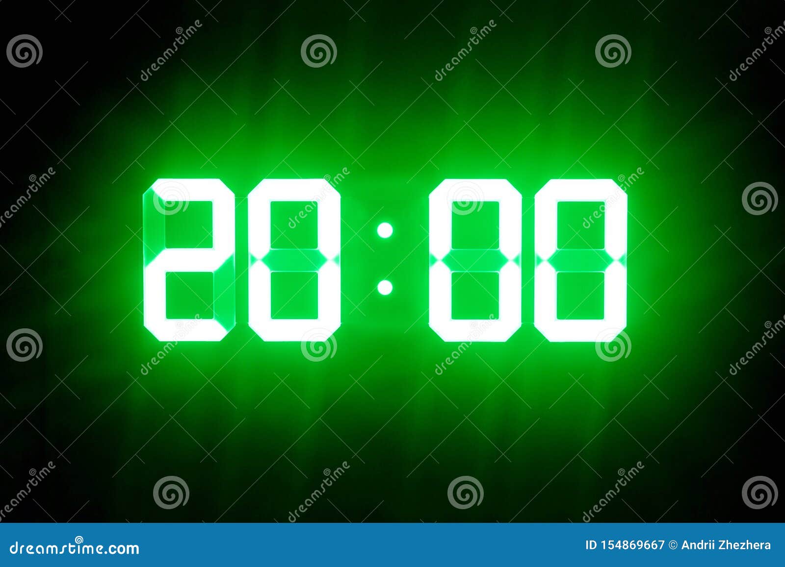 Green Glowing Digital Clocks in the Dark Show 20:00 Time Stock Image ...
