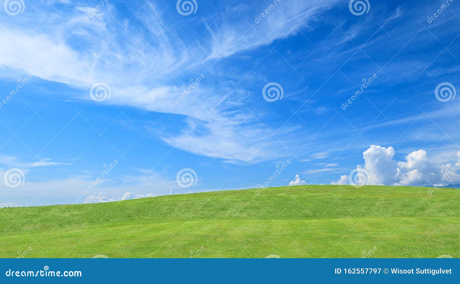 Green Grass Field On Small Hills And Blue Sky With Clouds For ...