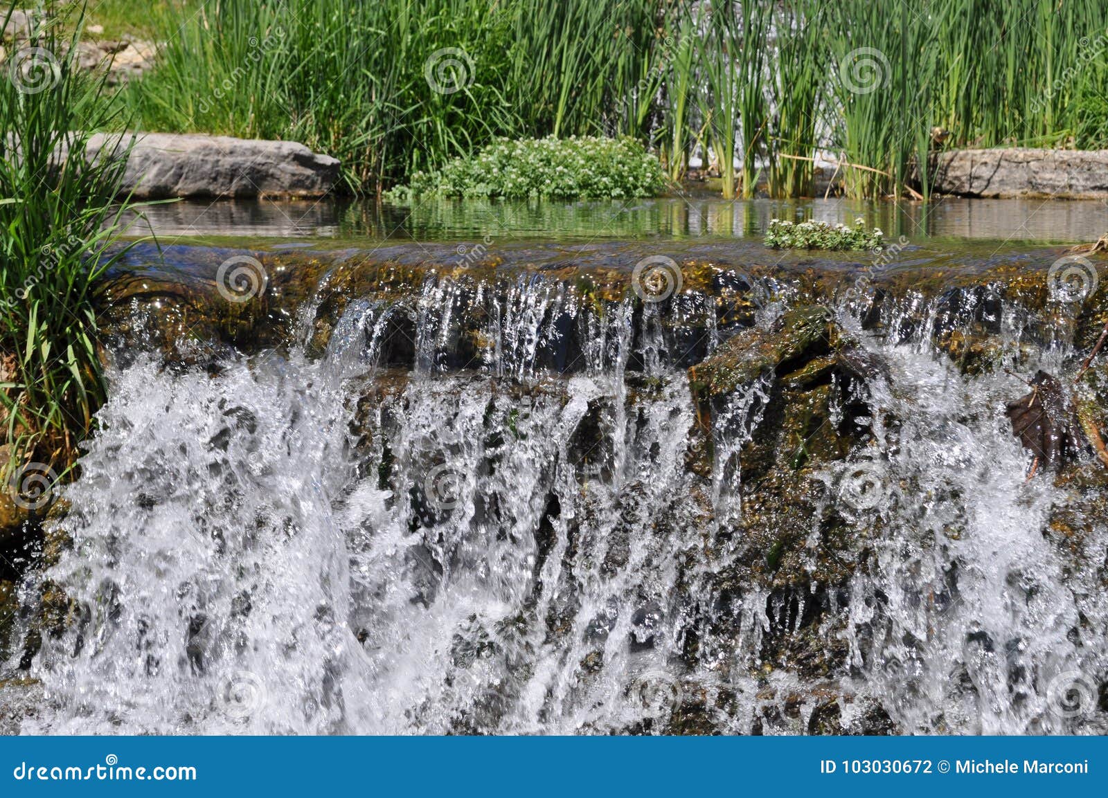 Striking Setting with Small Waterfall Running through. Stock Photo ...