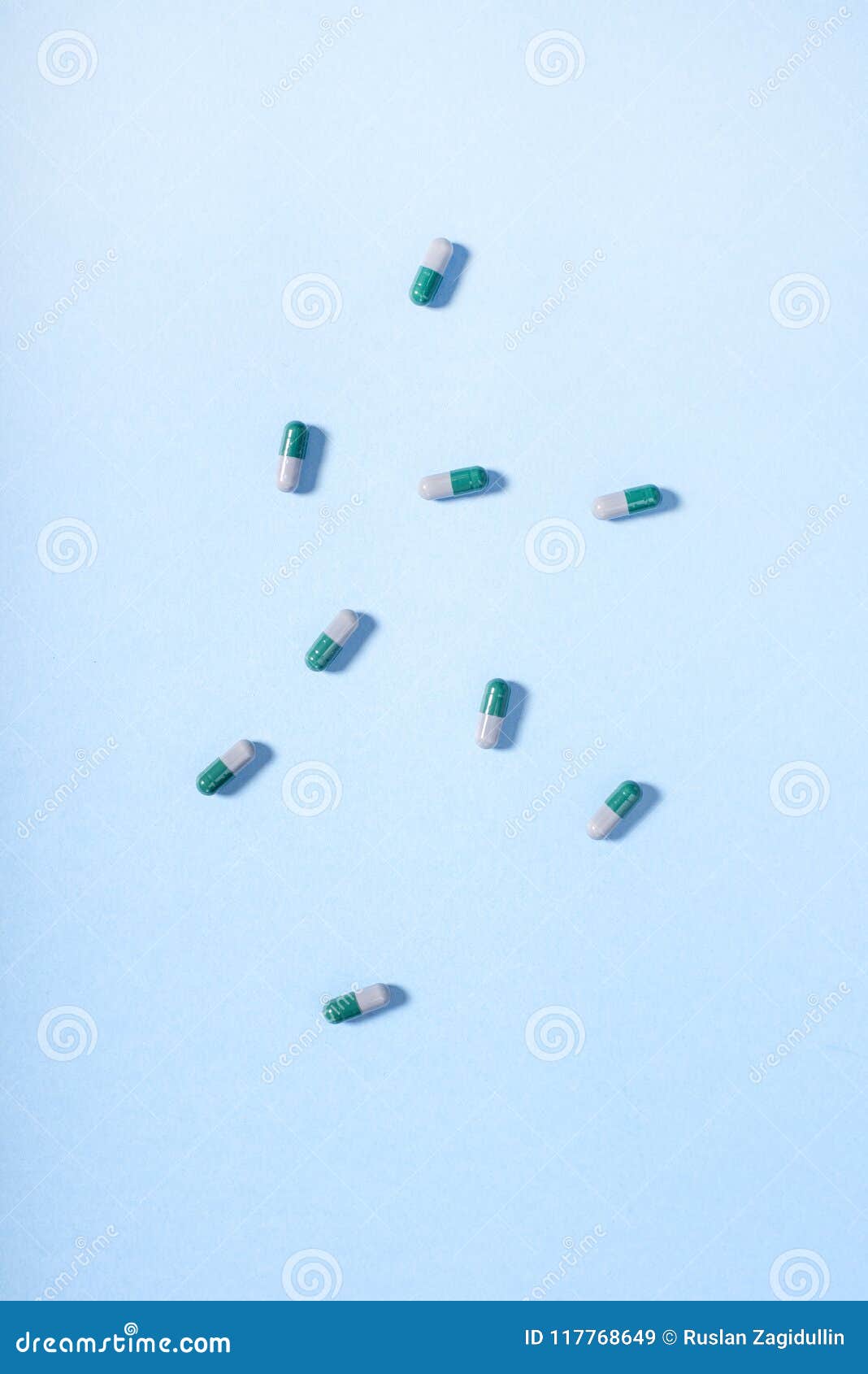 Green capsules on blue stock image. Image of narcotic - 117768649