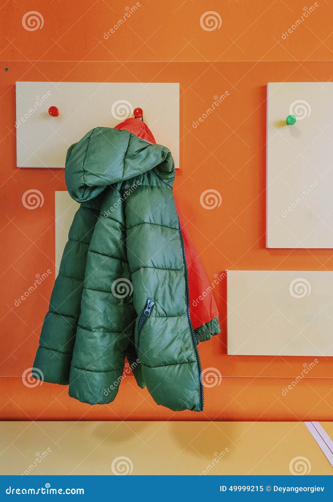 Green Jacket Hanging on a Children S Hanger Stock Image - Image of ...