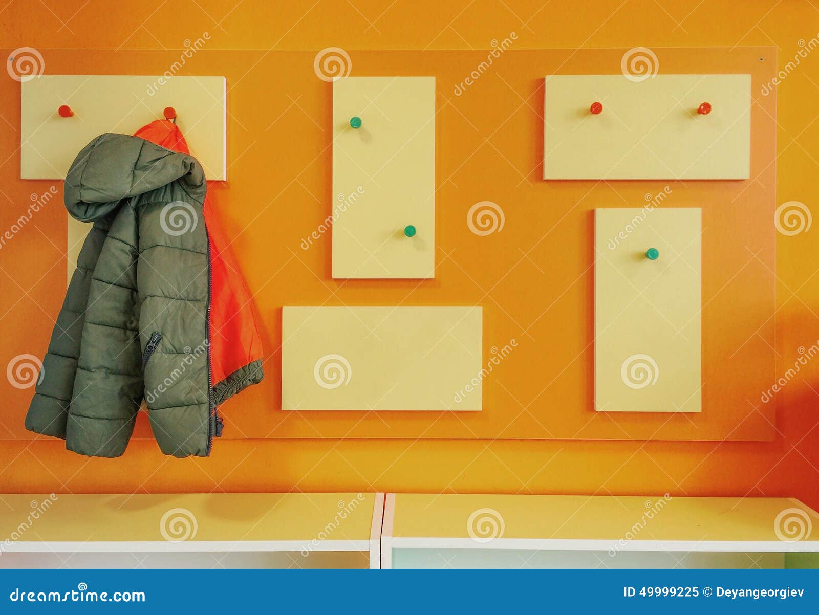 Green Jacket Hanging on a Children S Hanger Stock Image - Image of wall ...
