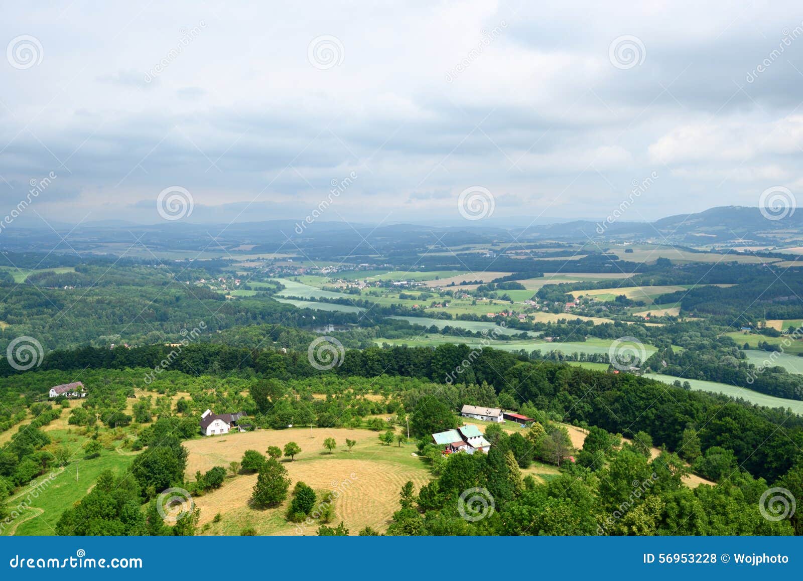 Green Landscape with Trees, Houses and Distant Hills Stock Photo ...