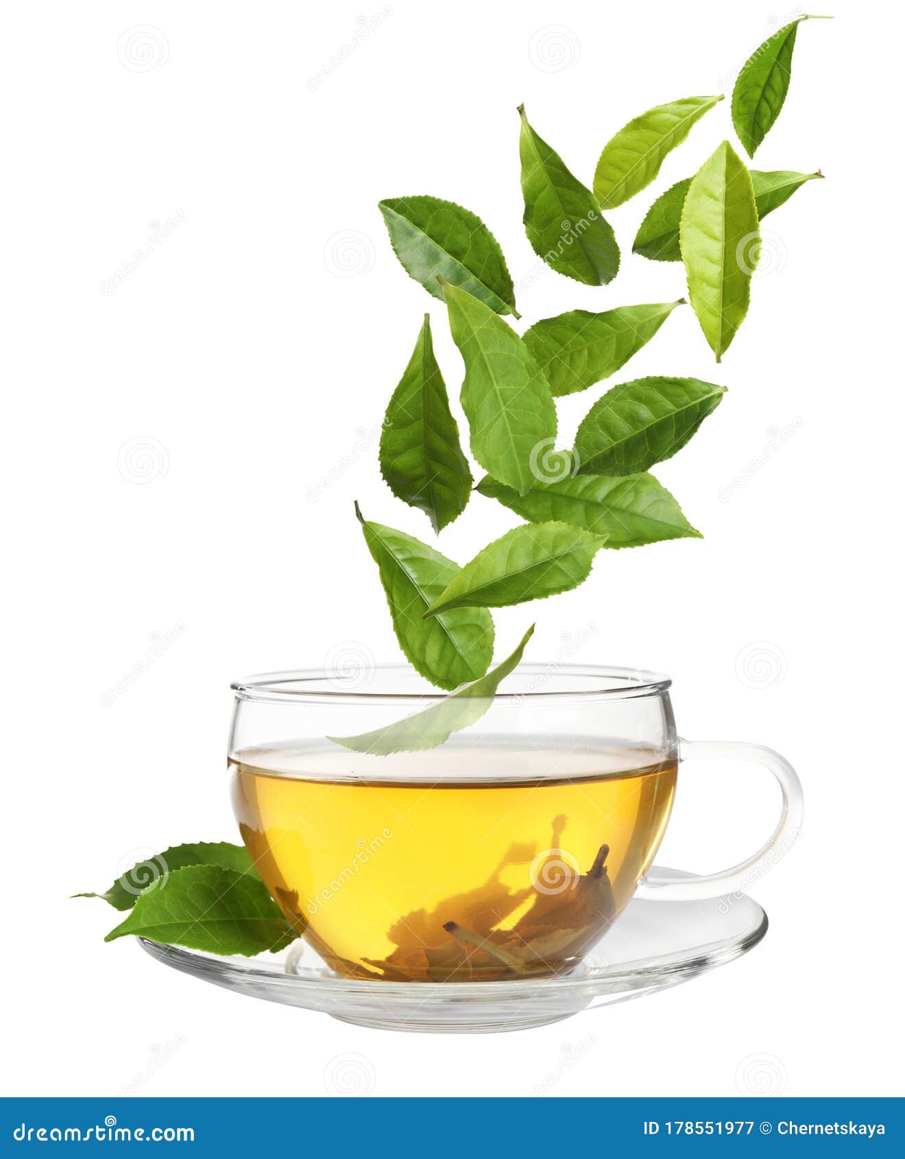 Green Leaves Falling into Cup of Tea on Background Stock Image - Image ...