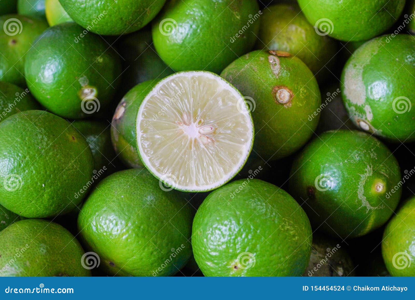 Green lemons stock photo. Image of delicious, background - 154454524