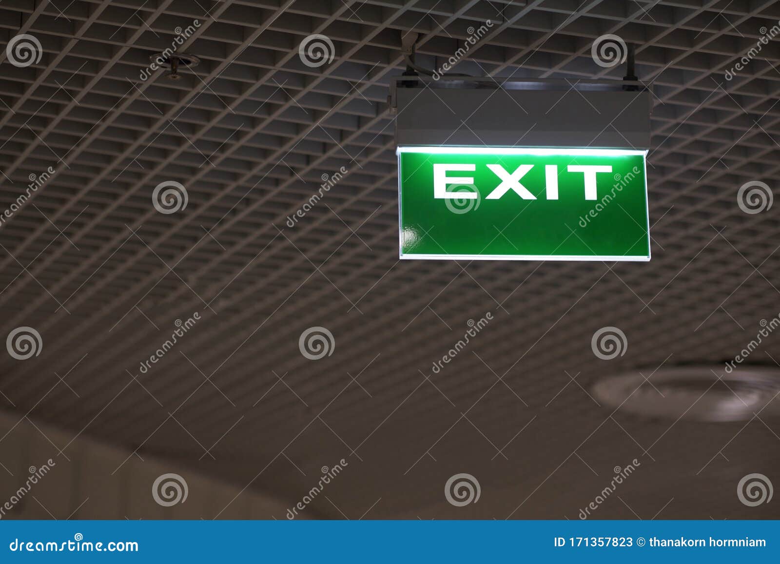 Green Light Fire Exit Sign in Office Building Stock Image - Image of ...