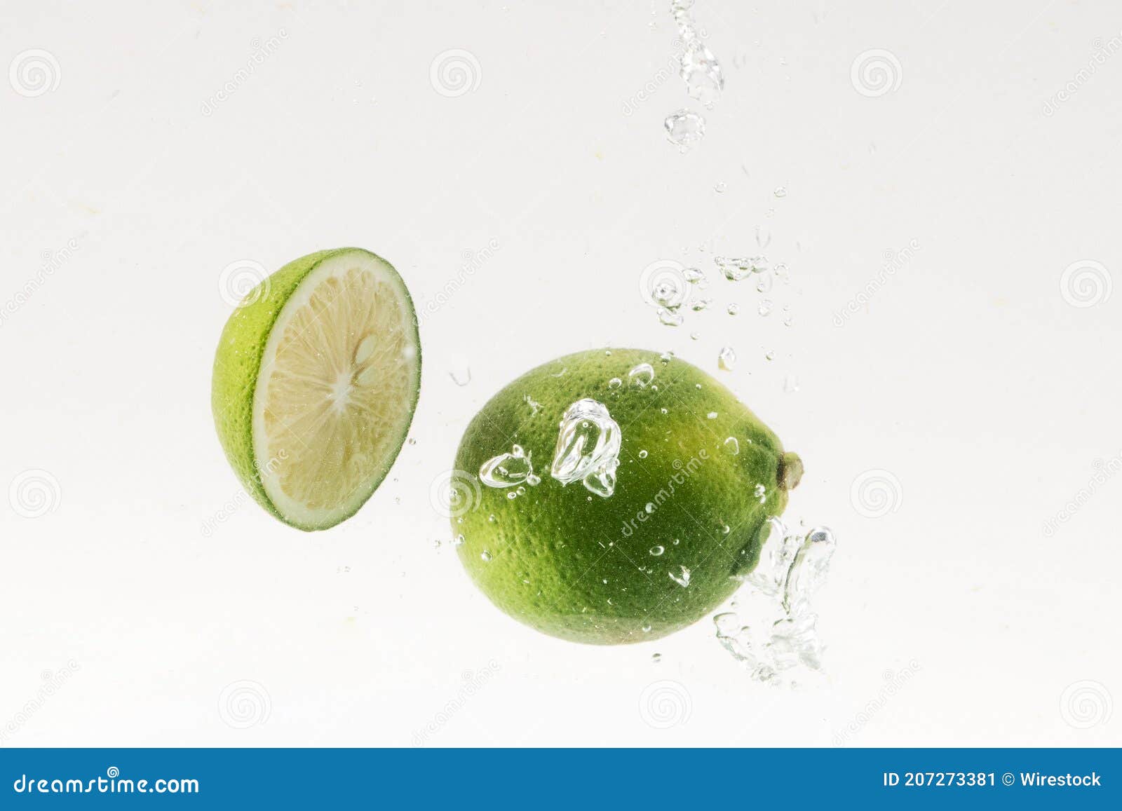 Lime Floating in Bubbling Water on White Background Stock Image - Image ...