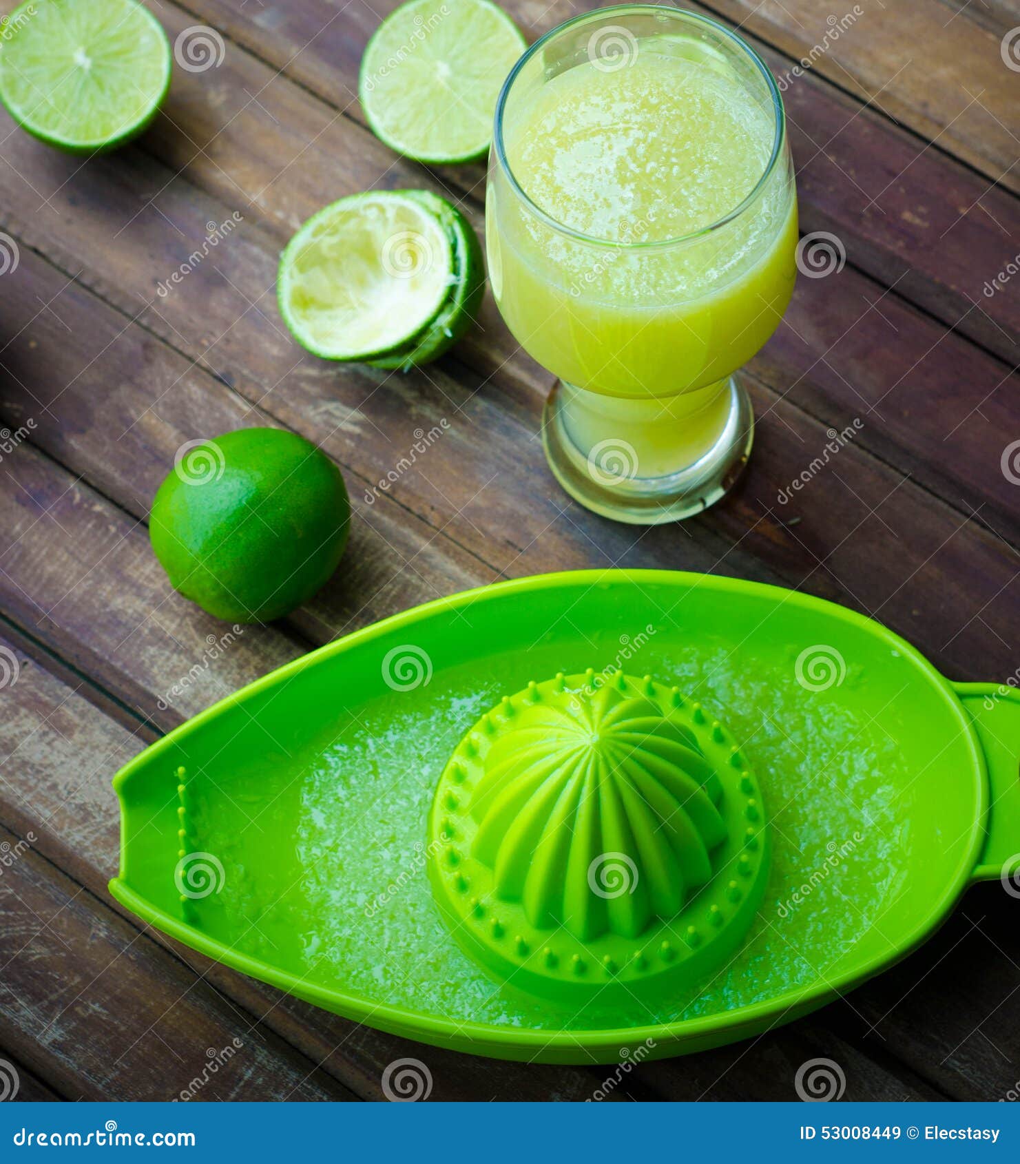 Green Limes with Green Manual Juicer on the Table Stock Image - Image ...