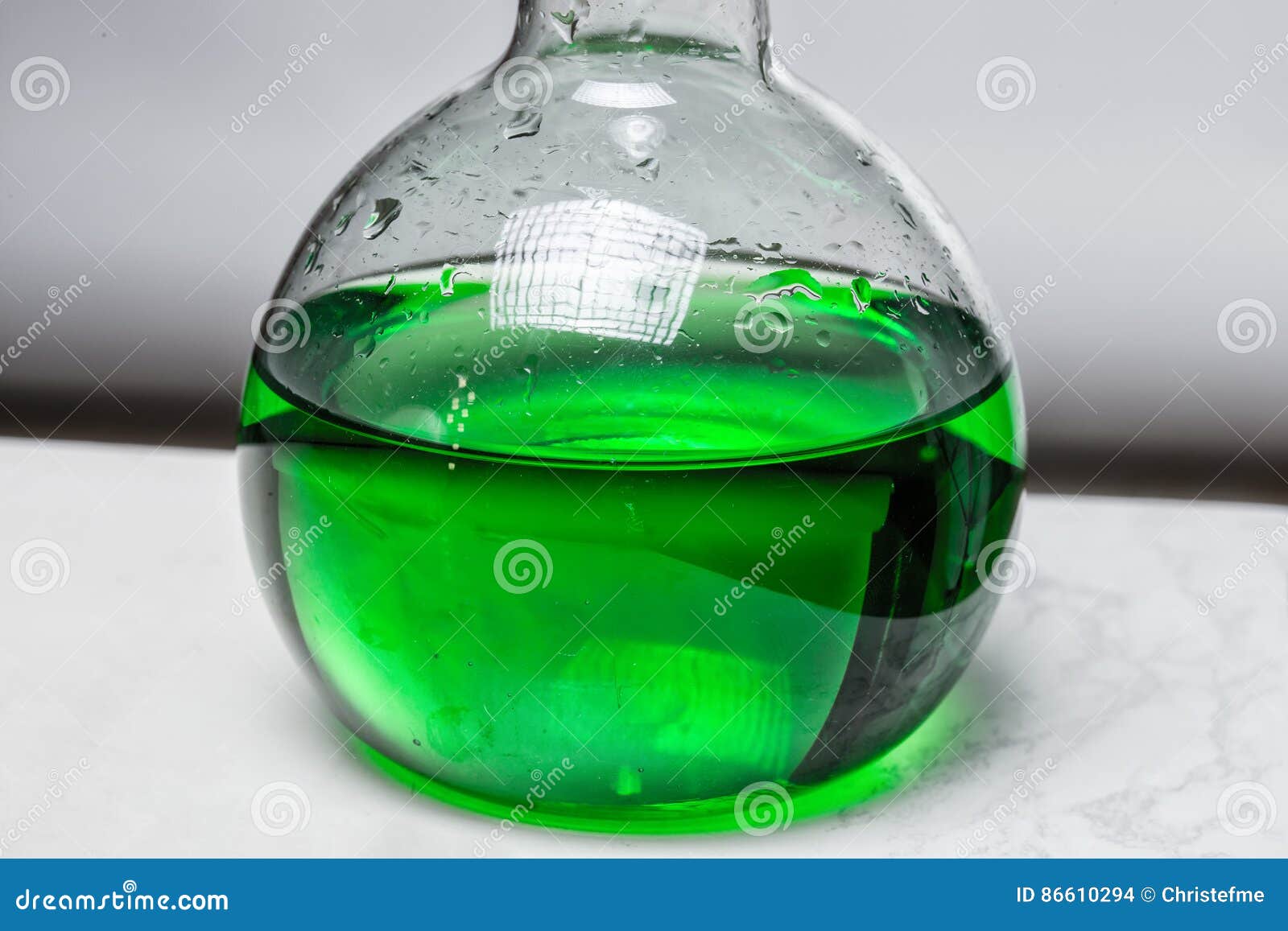 Green Liquid in Glass Flask Stock Photo - Image of laboratory, green ...