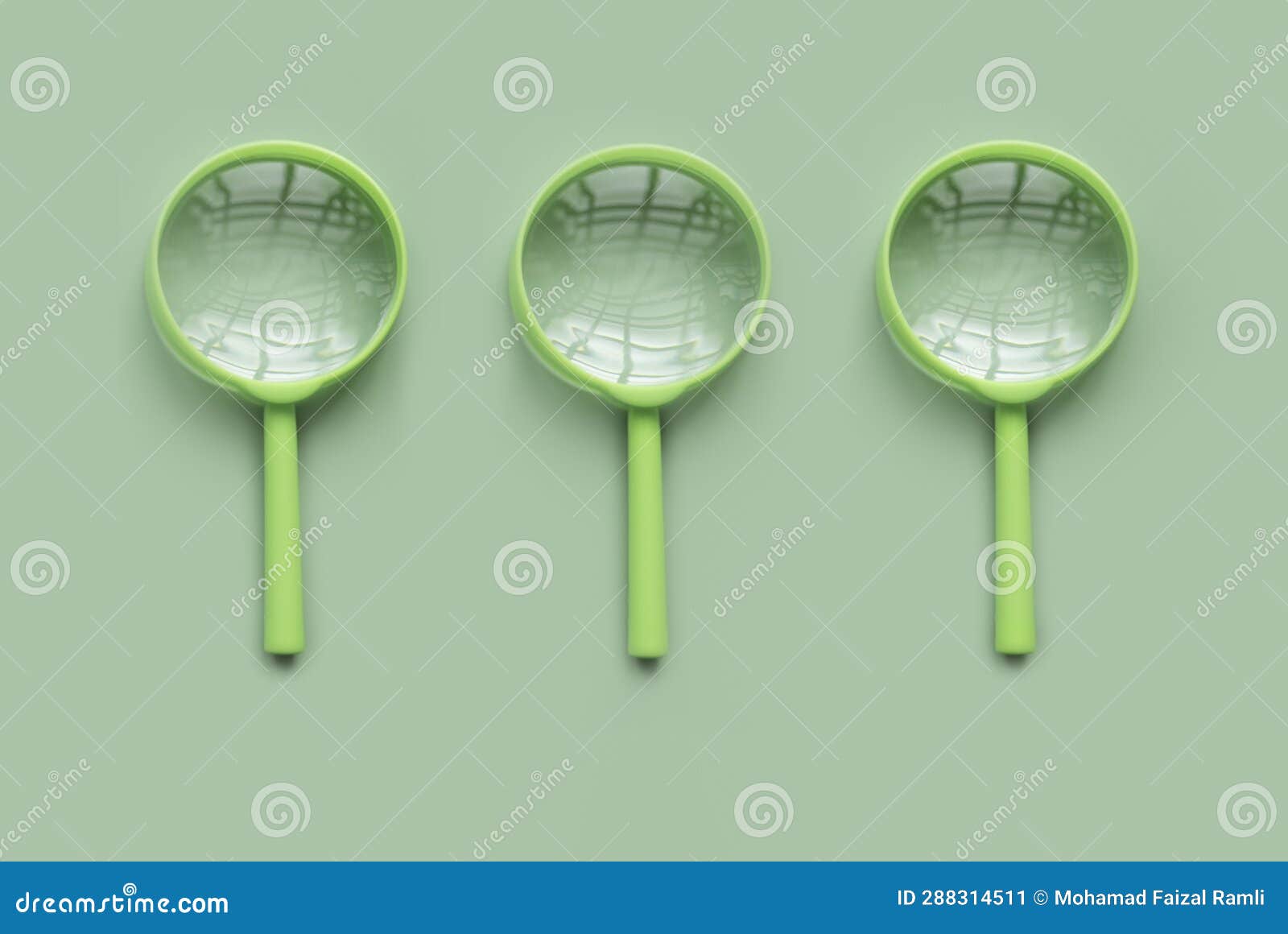 Green Magnifying Glass Over a Green Background Stock Image - Image of ...