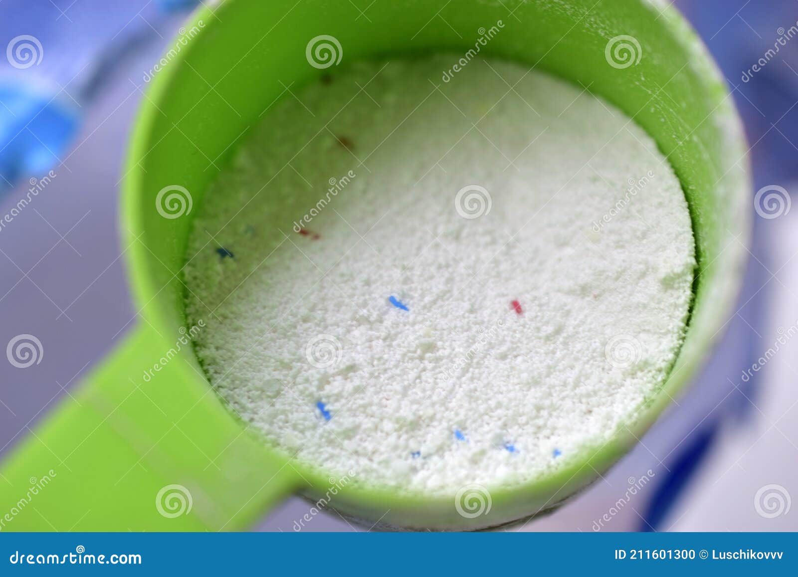 Green Measuring Cup for Washing Powder and Water Stock Photo - Image of ...