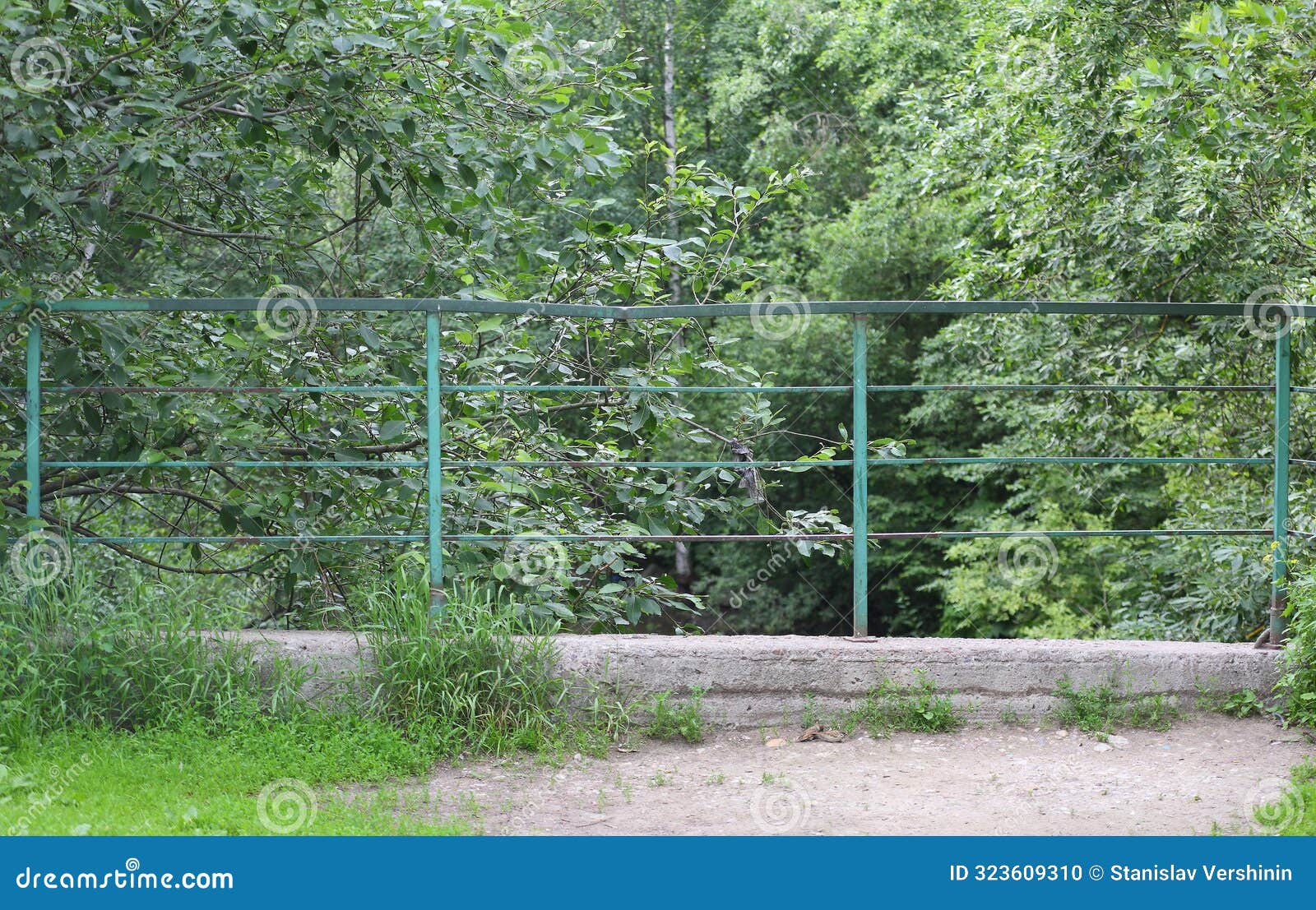 Green Metal Fence in Front of the Cliff Stock Photo - Image of metal ...