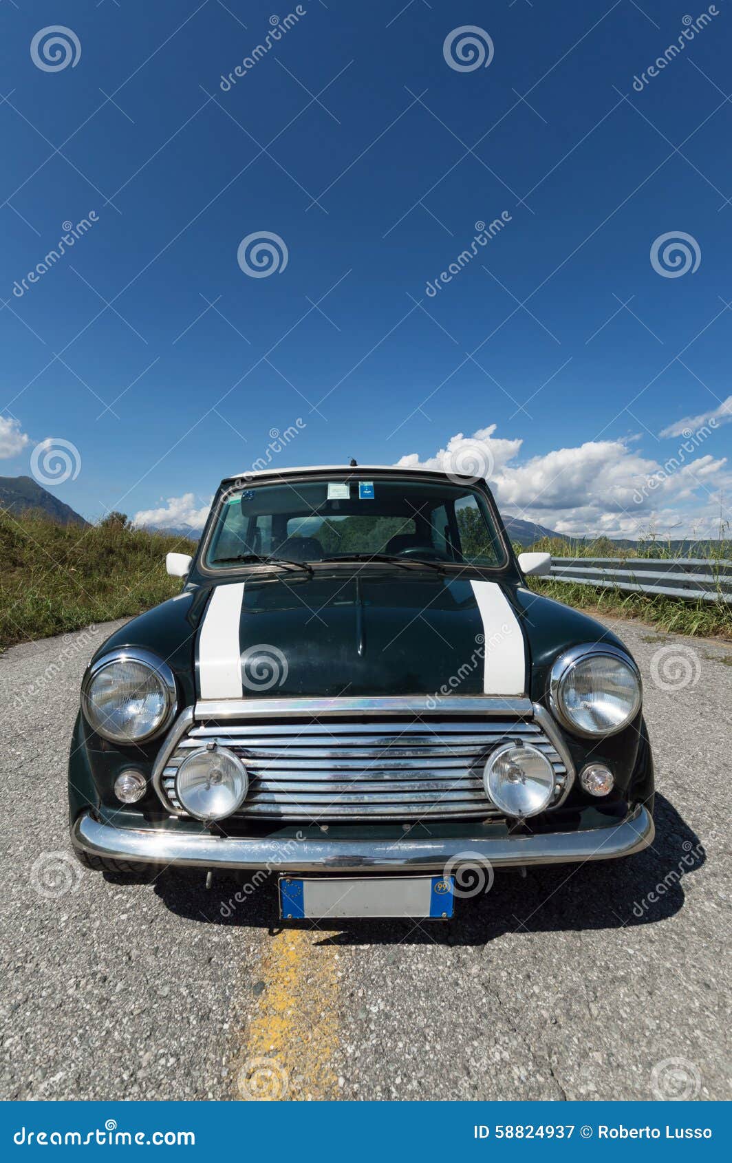 Green Mini Cooper with a Blue Sky Stock Image - Image of popular ...