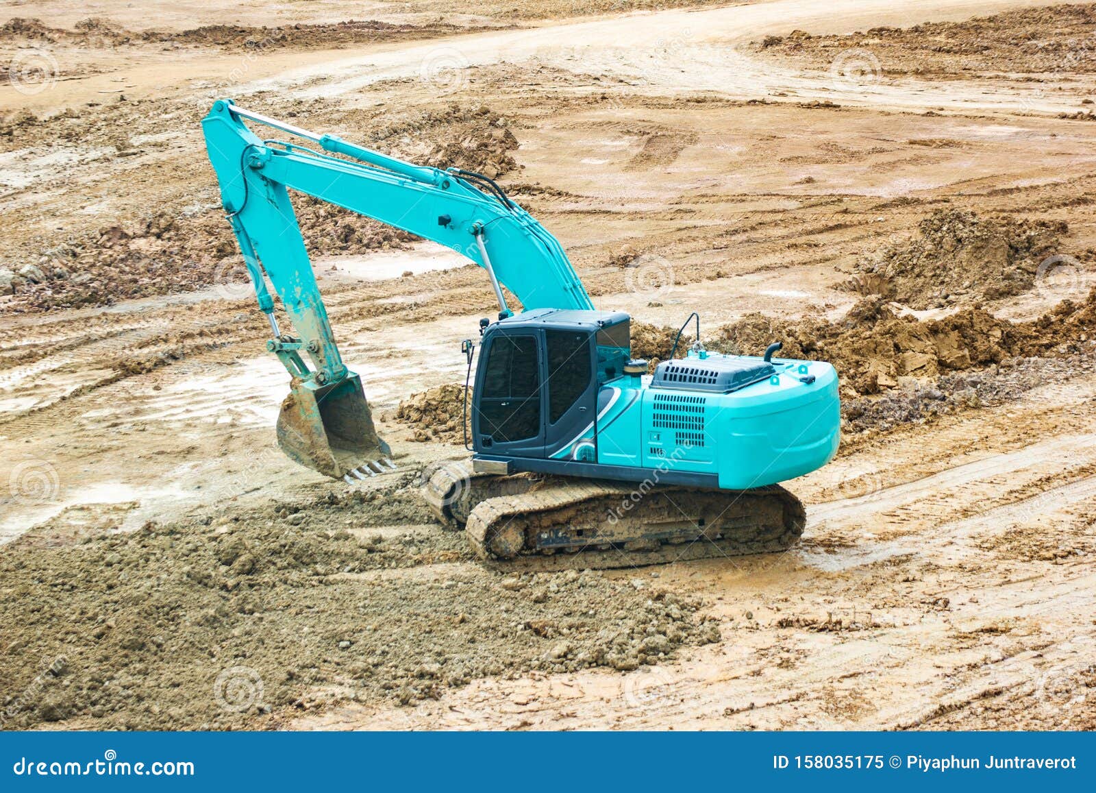 Green Mini Crawler Excavator Hydraulics Digging a Hole Concrete and ...