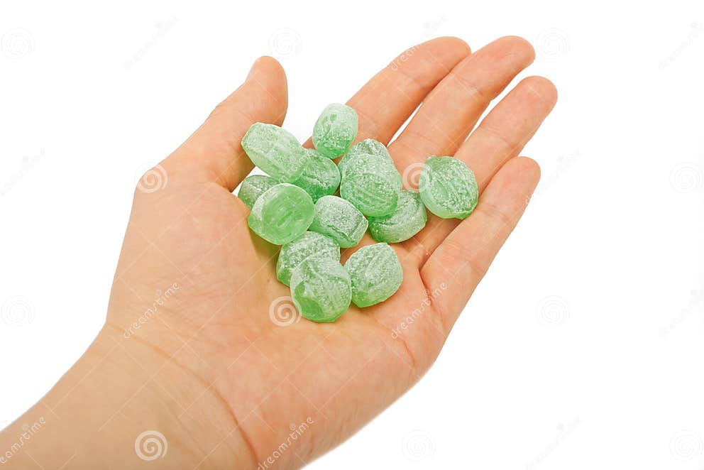 Green mints candy in hand stock image. Image of sugar - 59981633