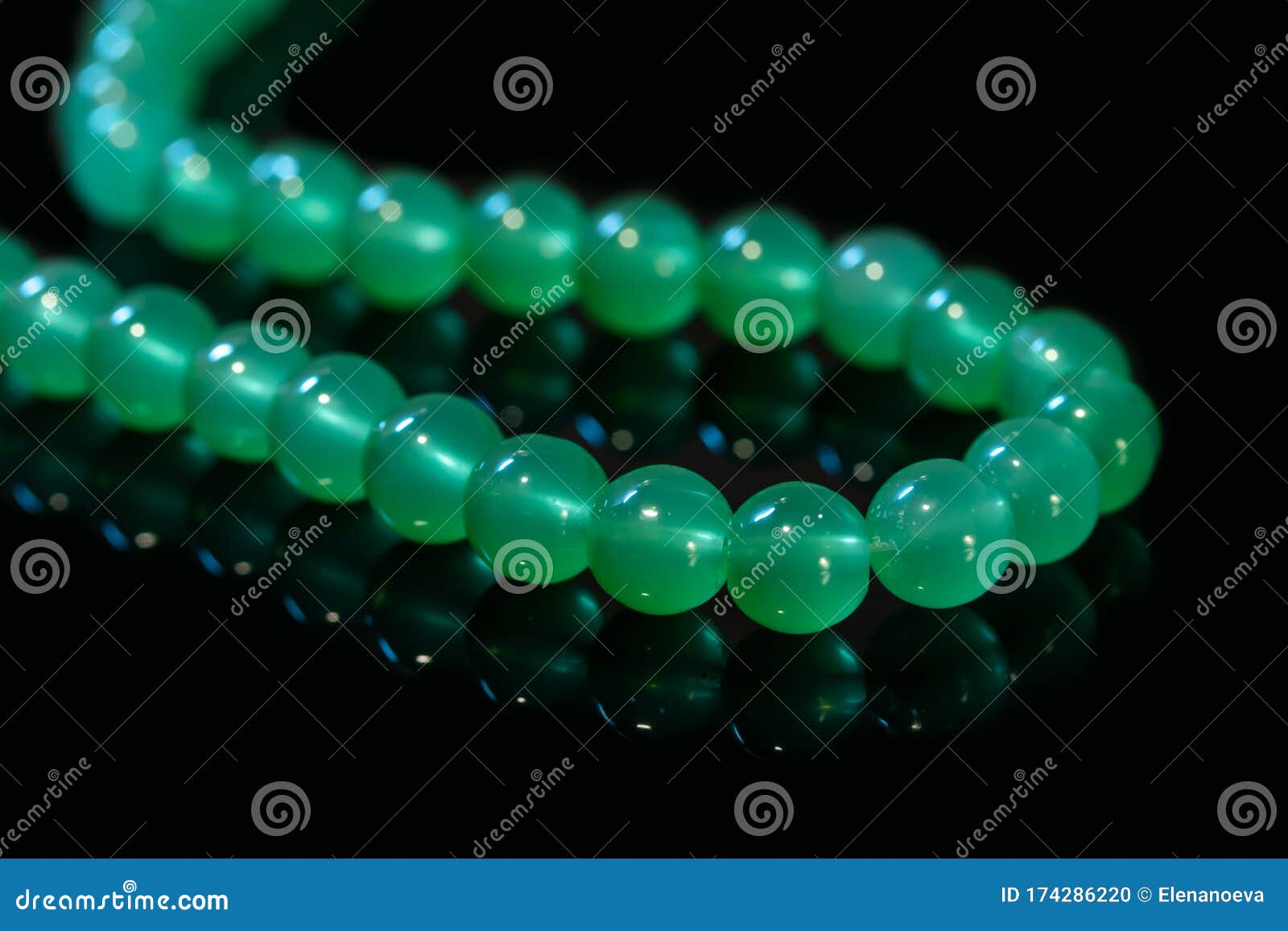 Green Nephritis Beads on Black Background Stock Photo - Image of ...