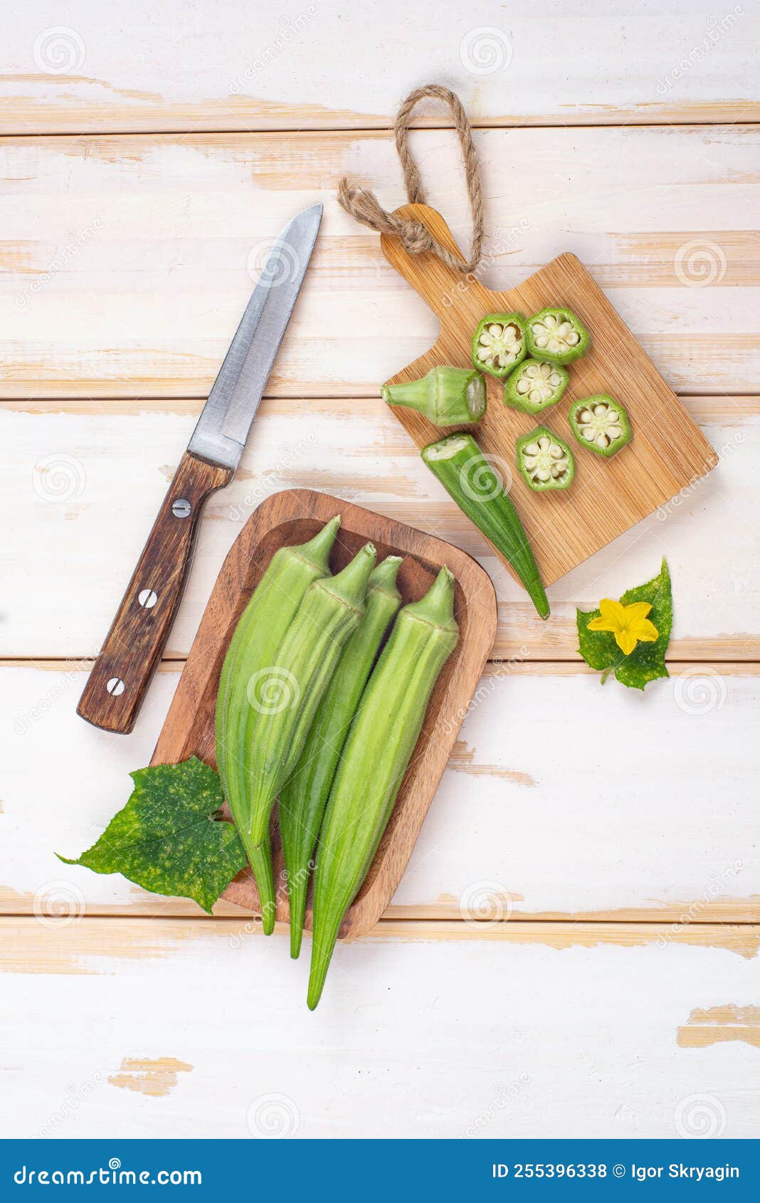 Green Okra Pods on Cutting Board with a Knife. on White Table Stock ...