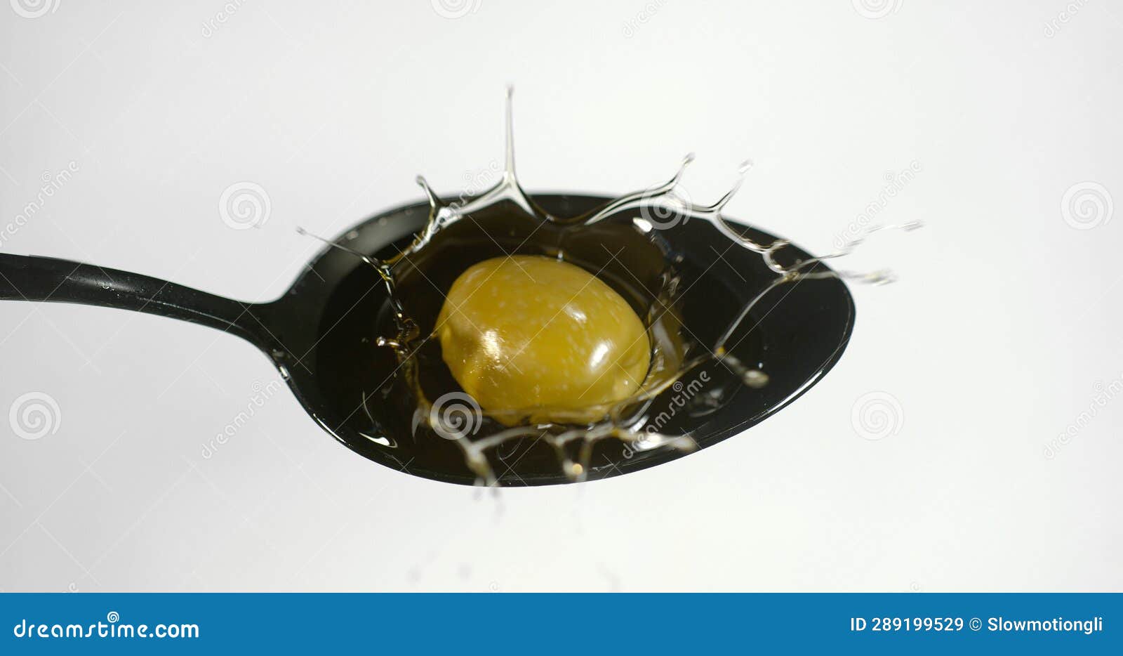 Green Olive, Olea Europaea, Falling in a Spoon Against White Background ...