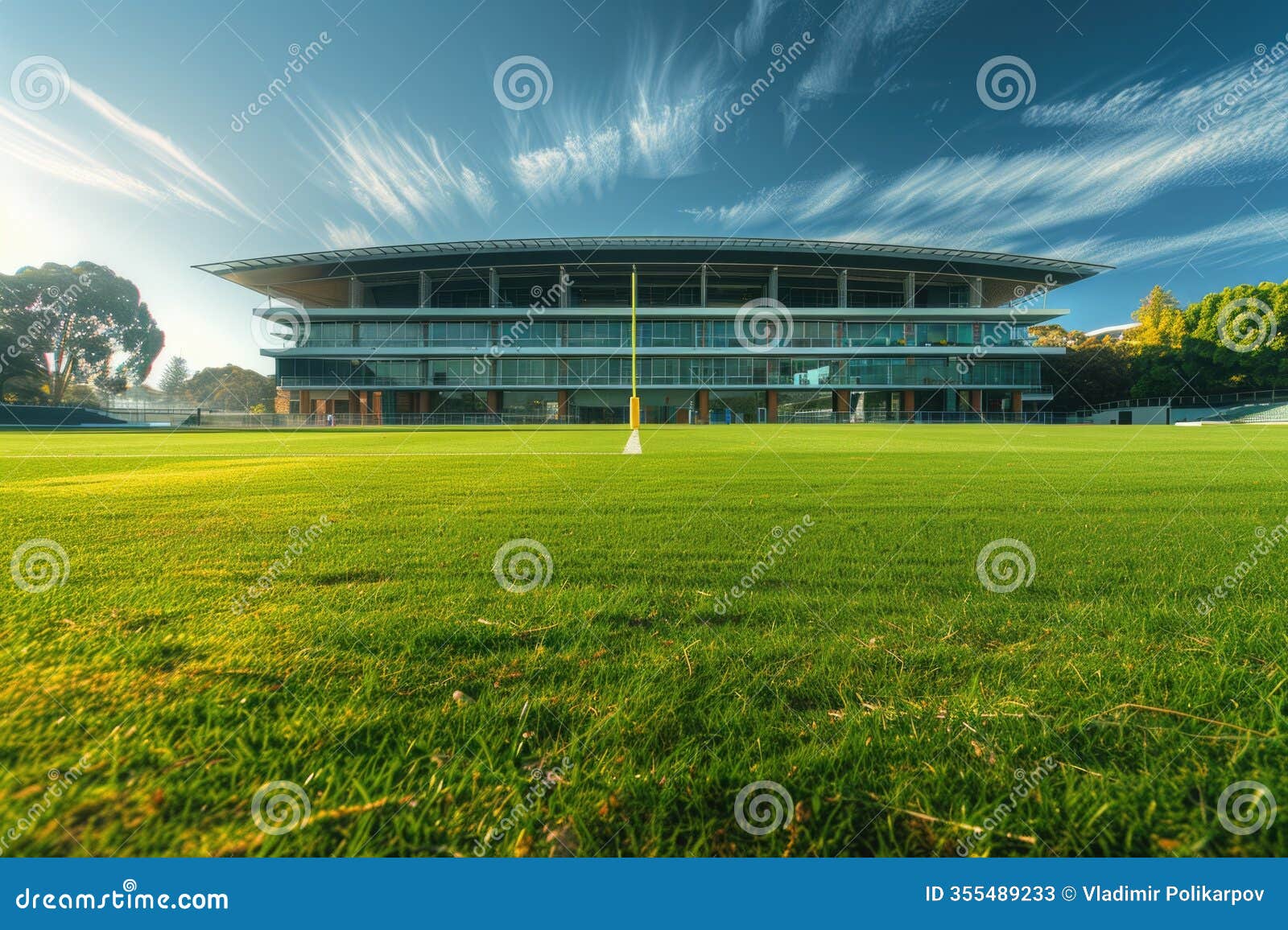 A Green Open Space with a Building in the Background, Suitable for Use ...