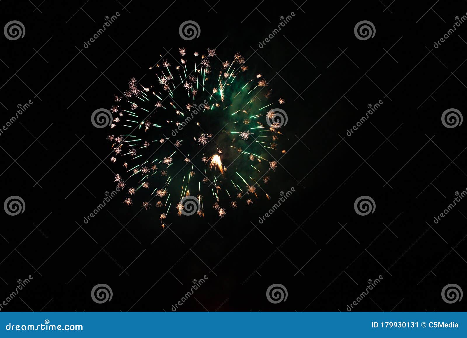 Green and Orange Dragon`s Eggs Firework Exploding in the Sky Stock ...