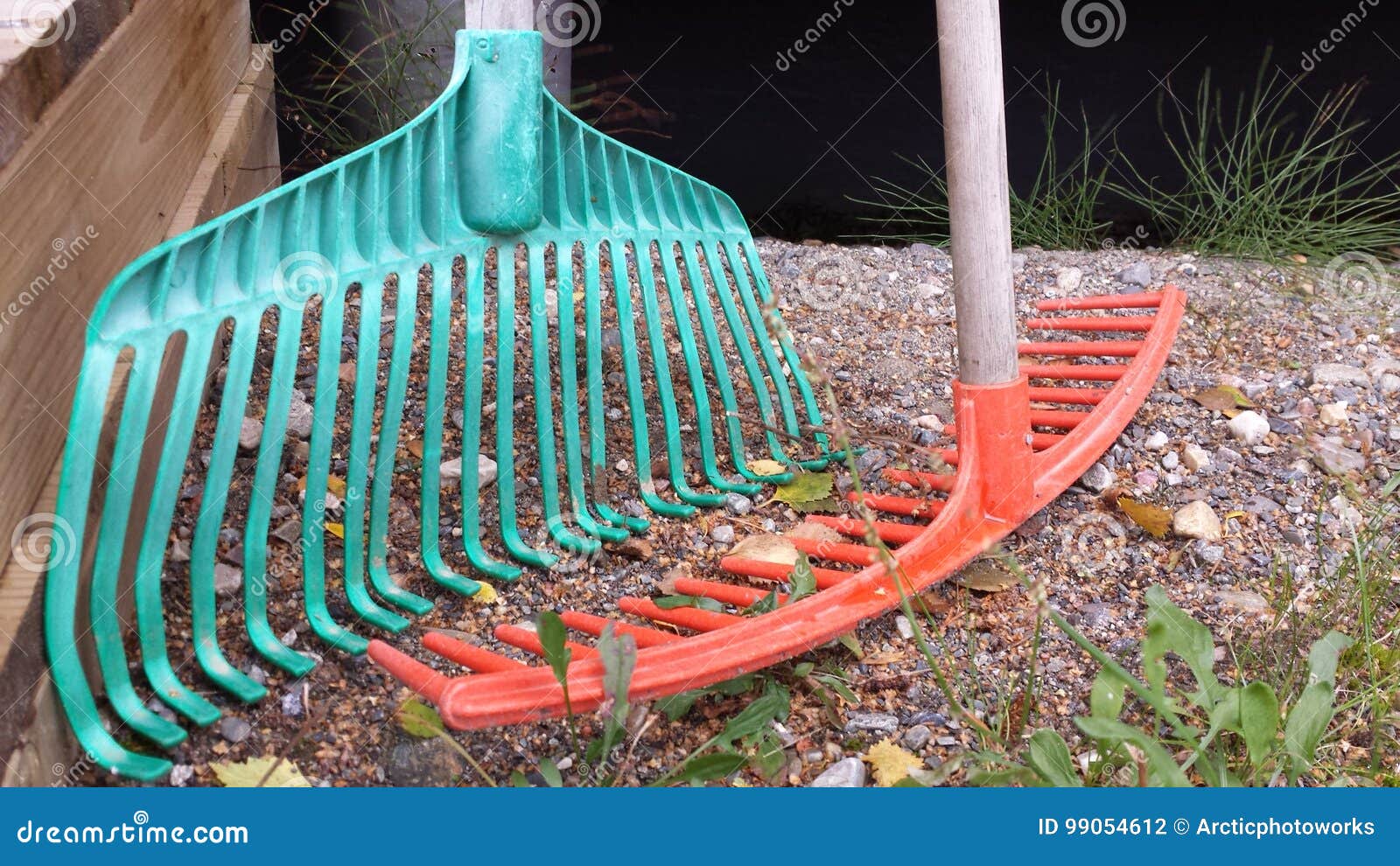 Green and orange rake stock photo. Image of shape, green - 99054612