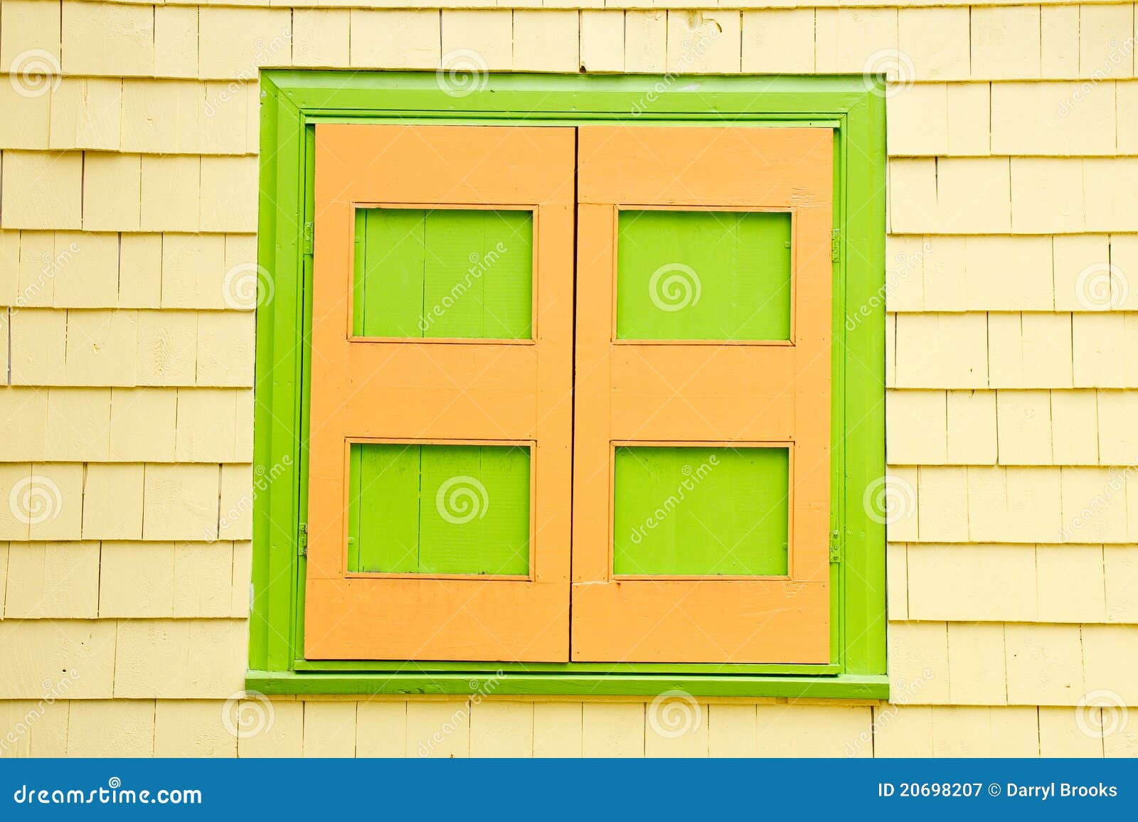 Green and Orange Shutters on Yellow Siding House Stock Image - Image of ...