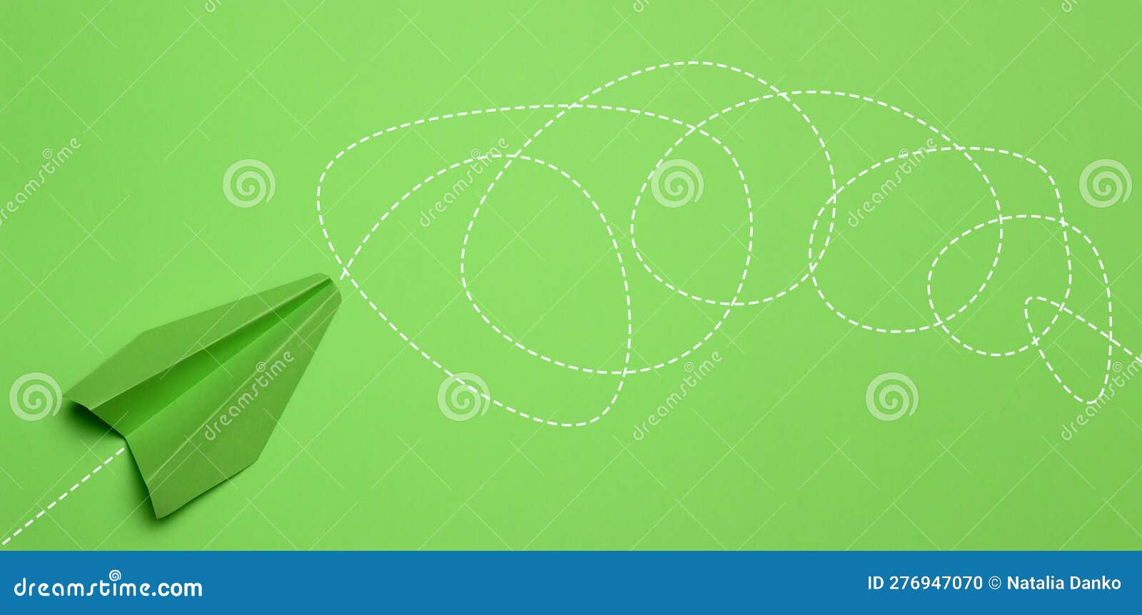 A Green Paper Airplane On A Green Background With A Long And Convoluted ...