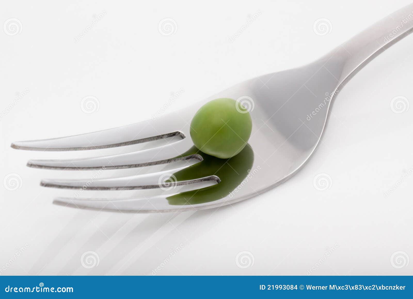 Green pea on a fork stock photo. Image of detail, cutlery - 21993084