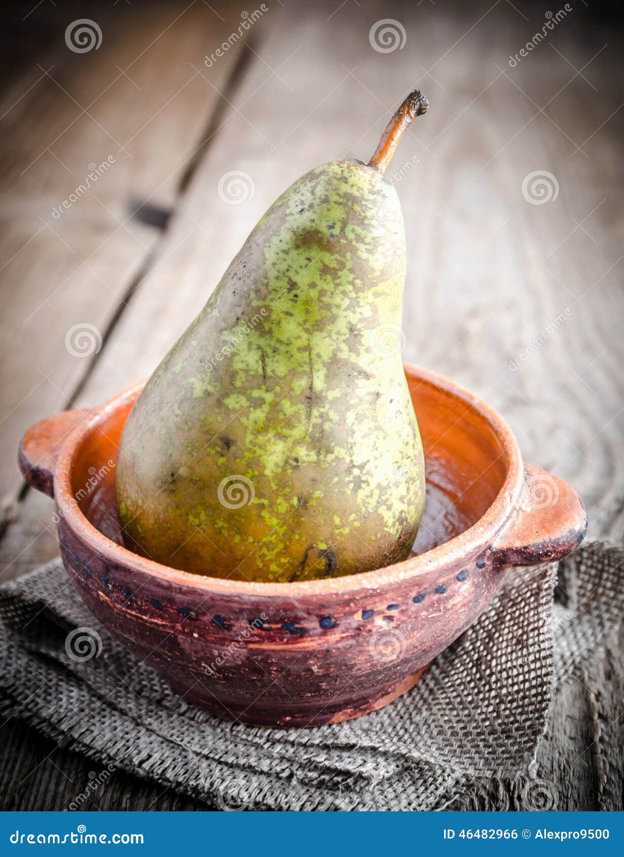 Green pear in rustic decor stock photo. Image of life - 46482966