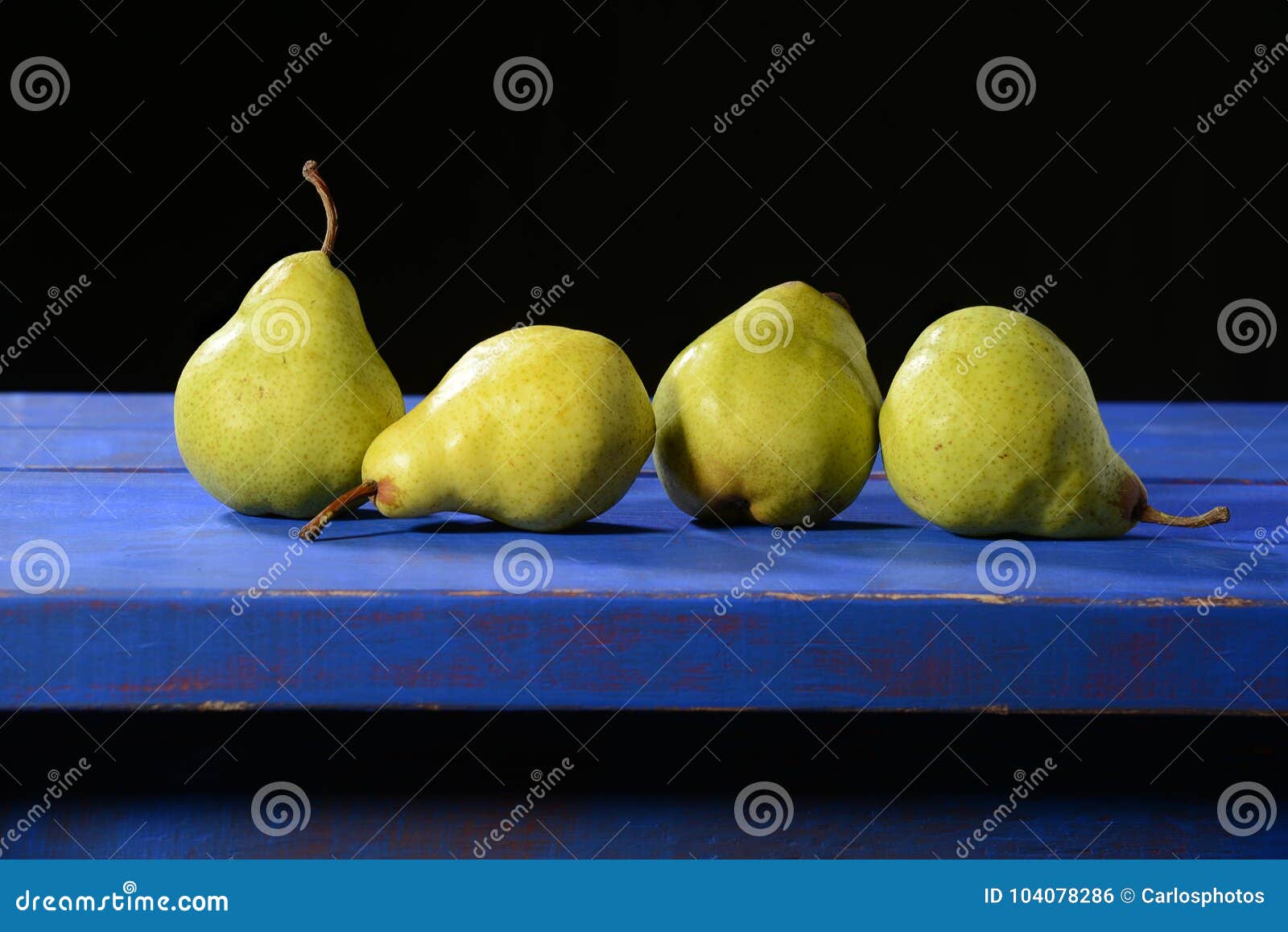 Green Pears Sitting on a Blue Table Stock Photo - Image of harvest ...