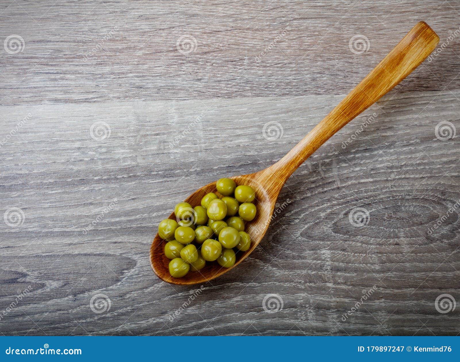 Green Peas in a Wooden Spoon Stock Image - Image of white, peas: 179897247