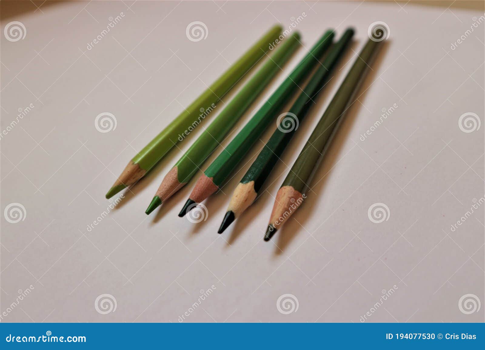 GREEN PENCILS SIDE by SIDE stock photo. Image of side - 194077530