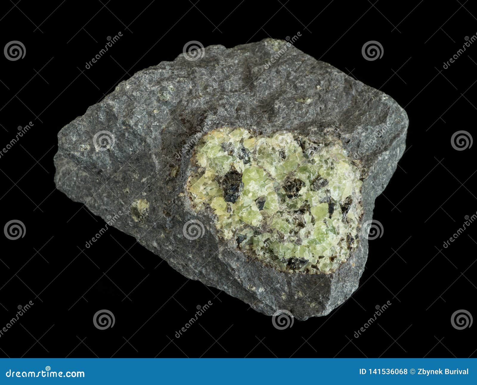 Green Peridote Olivine in Dark Basalt Rock Stock Photo - Image of ...