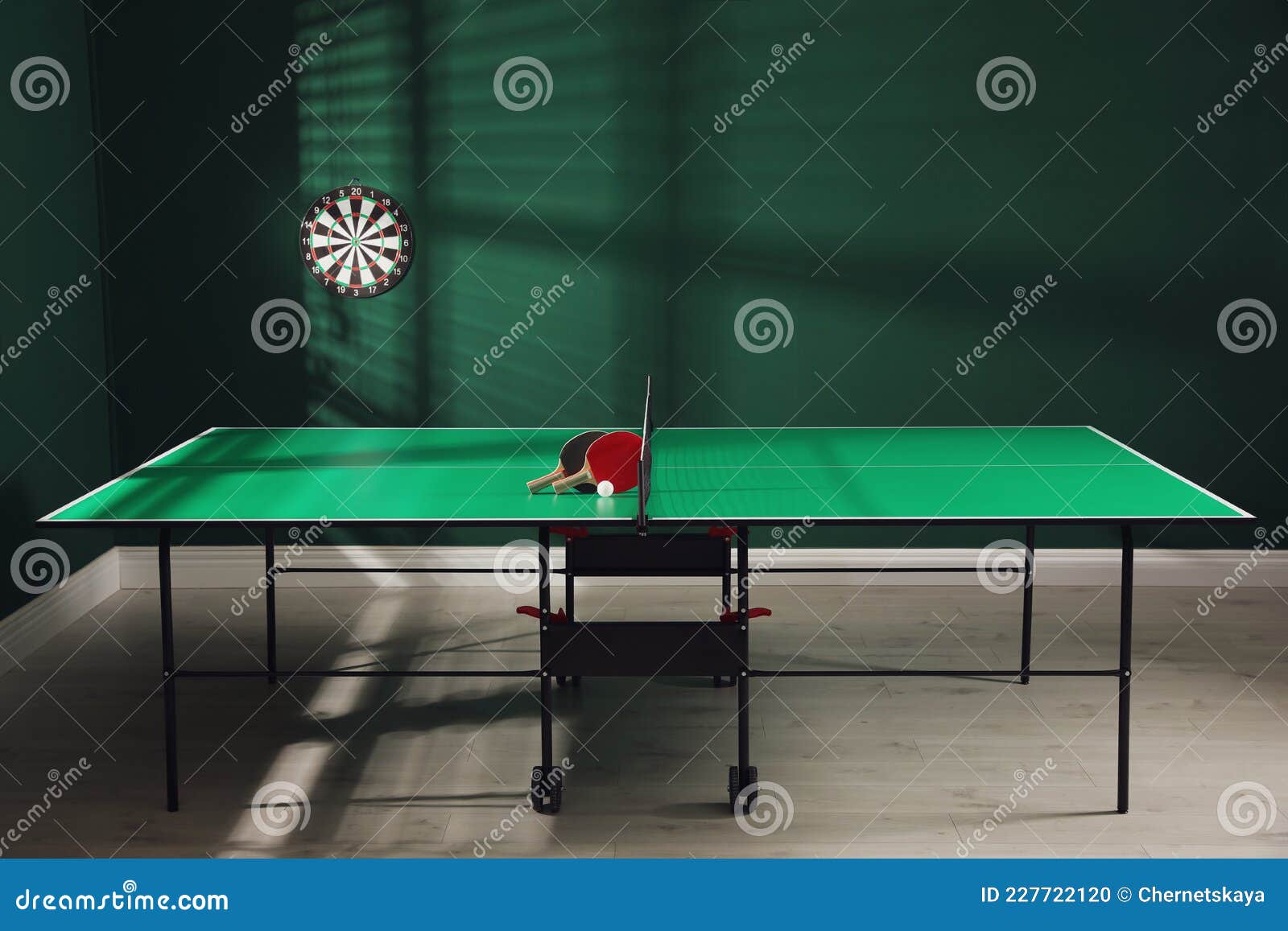 Green Ping Pong Table with Rackets and Ball Indoors Stock Photo - Image ...