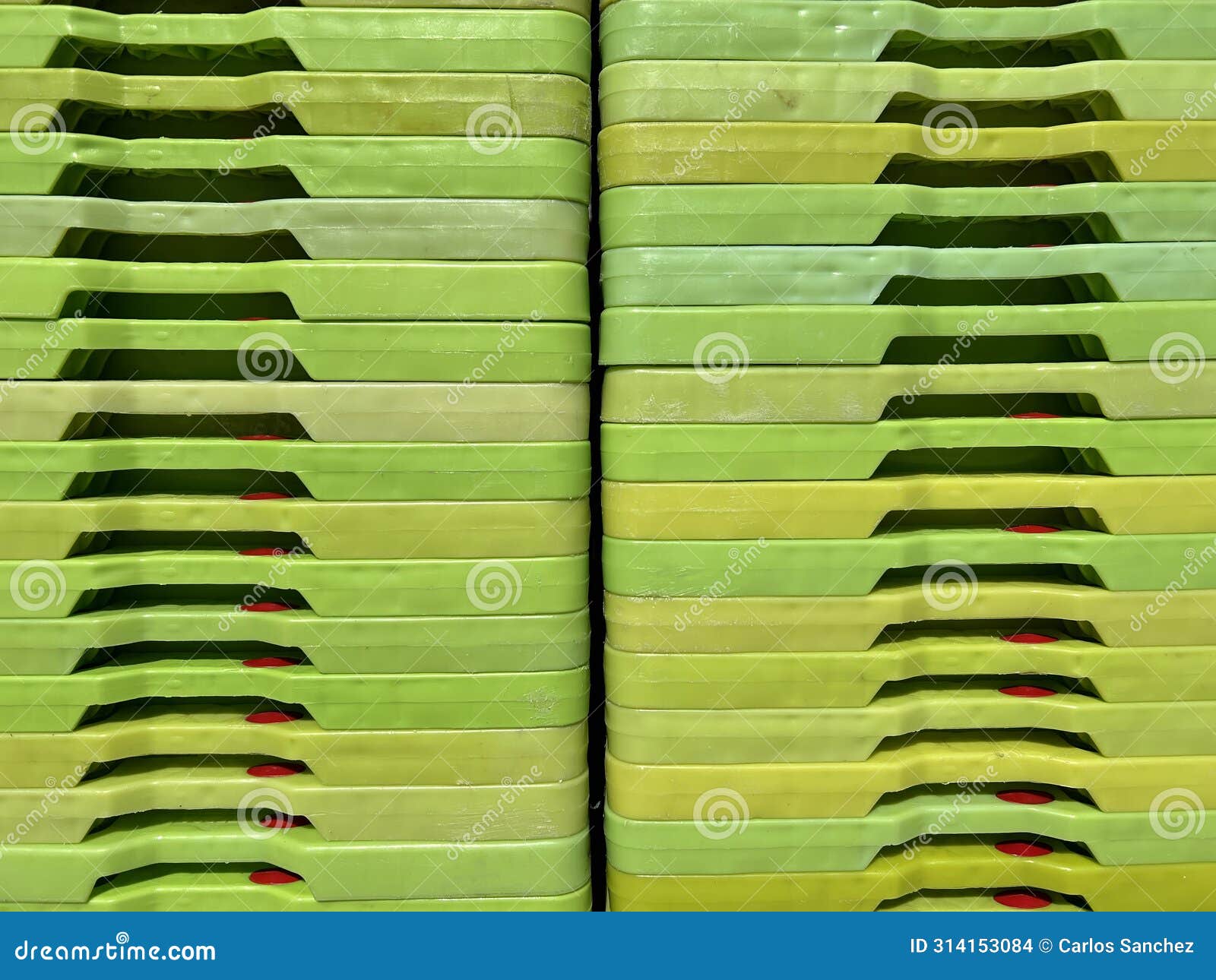 Green Plastic Boxes, Folded and Stacked To Form a Pattern Stock Photo ...
