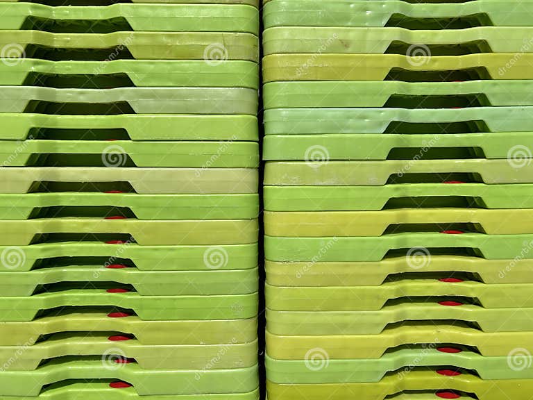 Green Plastic Boxes, Folded and Stacked To Form a Pattern Stock Photo ...
