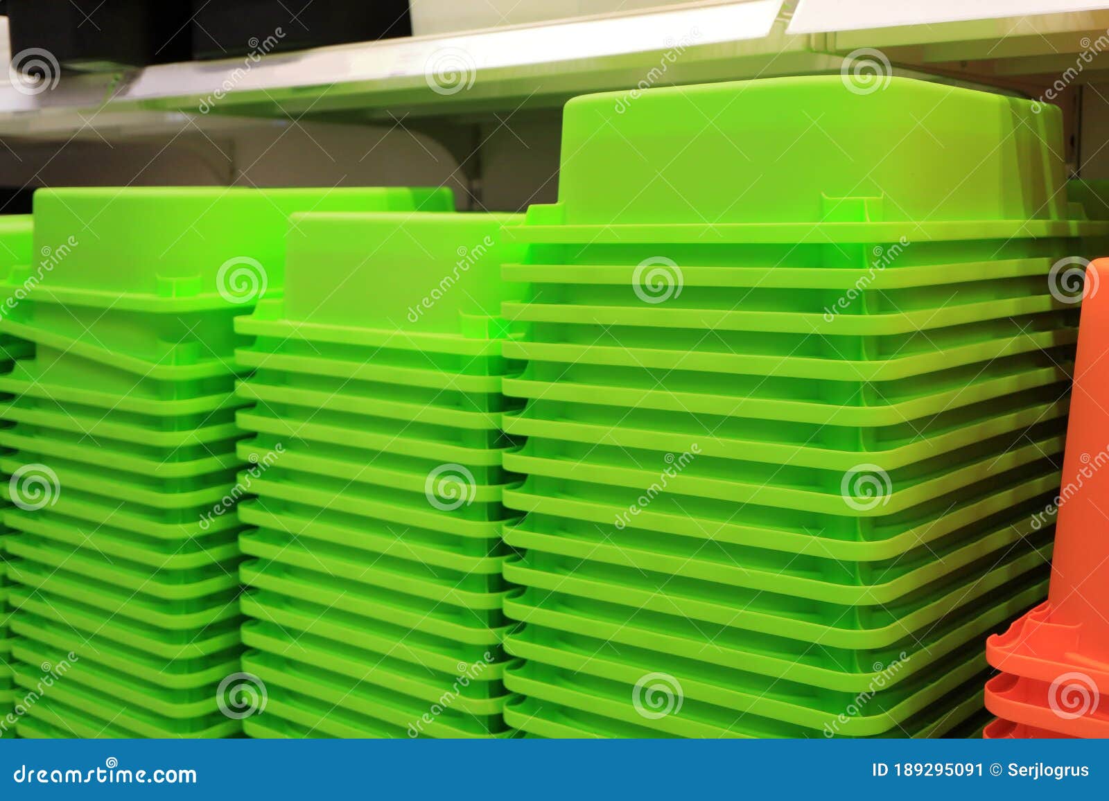Green Plastic Boxes Lie on the Shelf of the Store Stock Image - Image ...