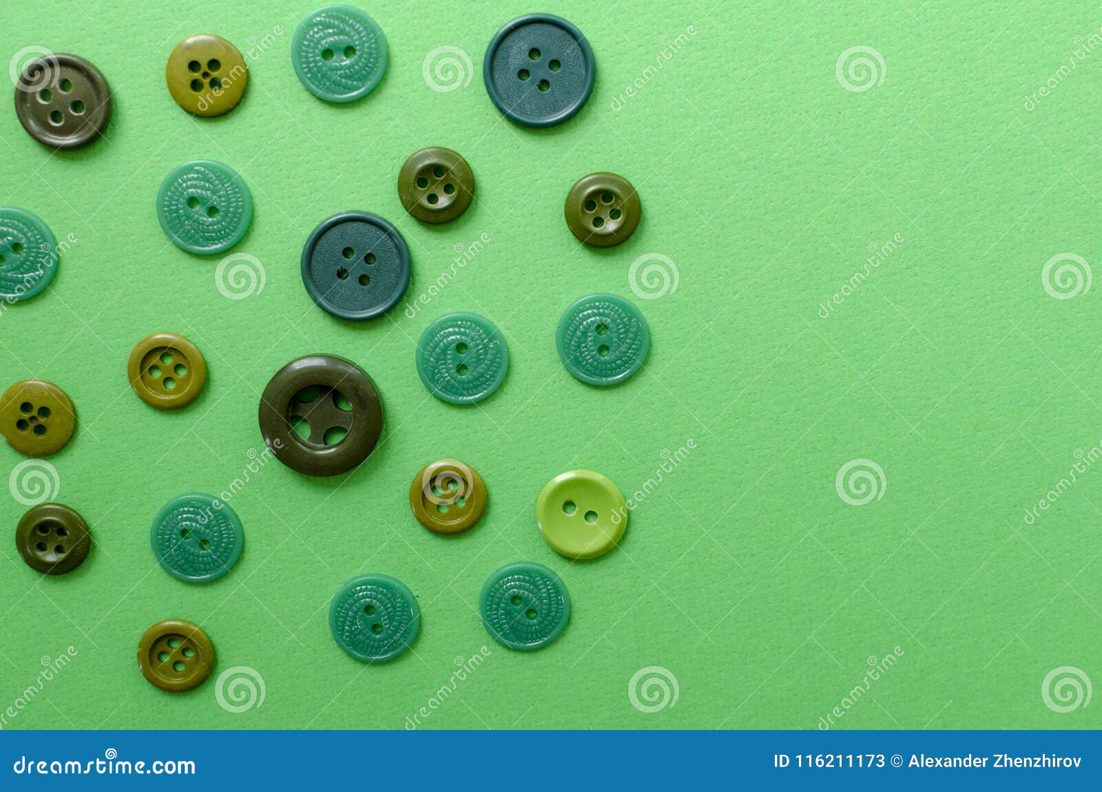 Green Plastic Buttons on Green Paper Background Stock Image - Image of ...