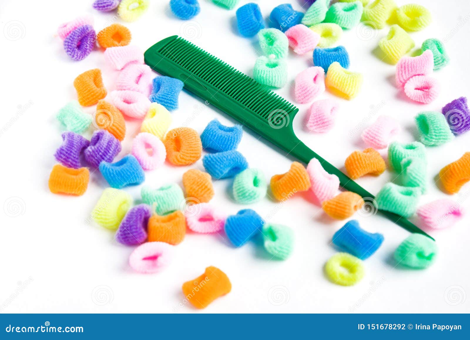 Green Plastic Comb and Bright Multi-colored Scrunchies on White Stock ...
