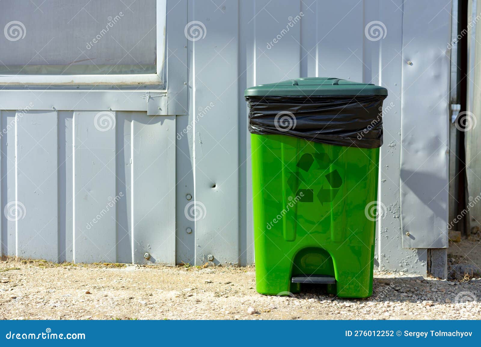Green Plastic Garbage Container Standing in the Street Stock Photo ...