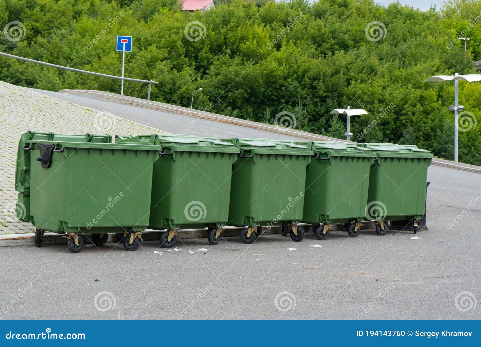 Green Plastic Garbage Containers Installed Along in the Park. the ...