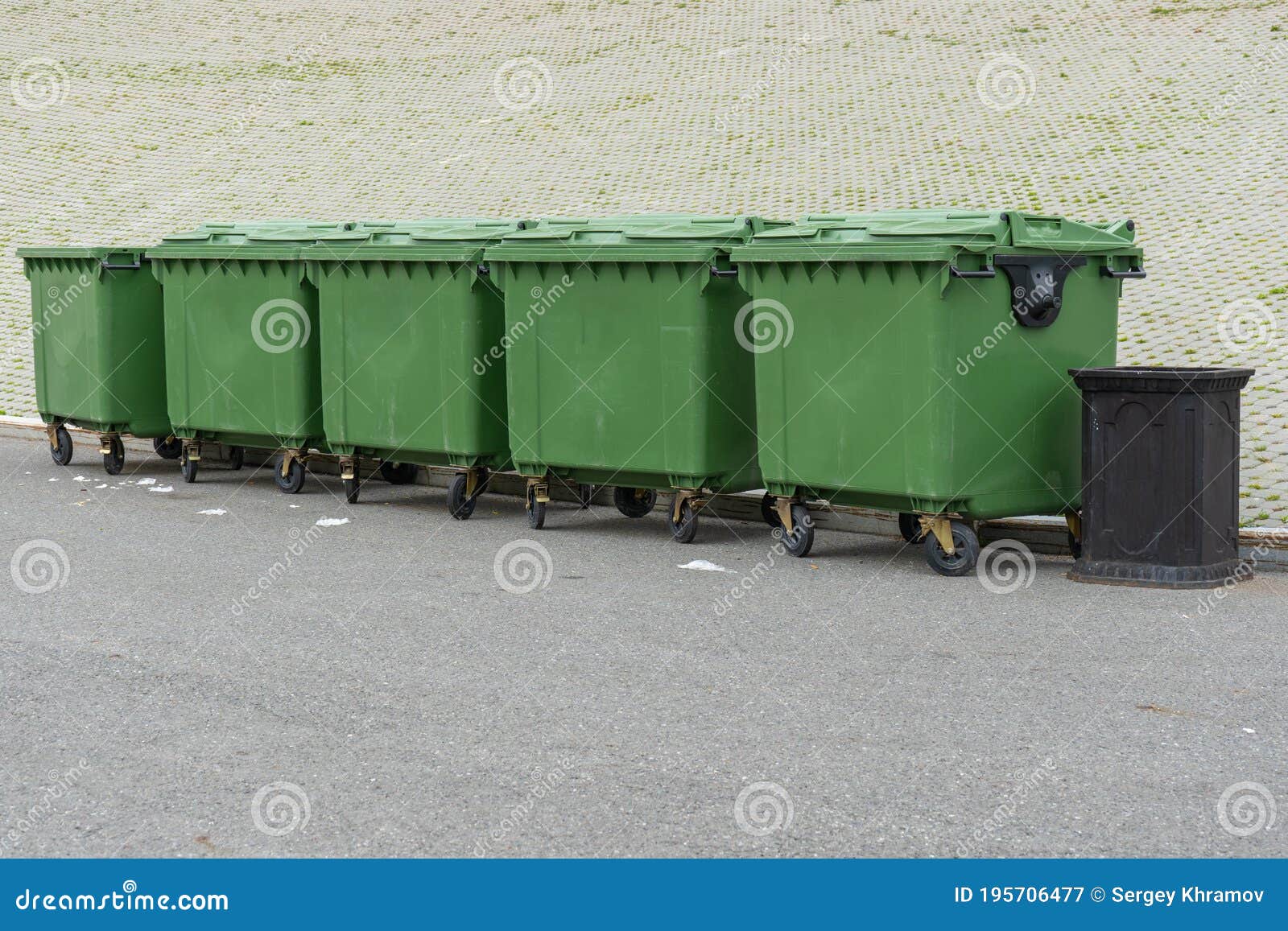 Green Plastic Garbage Containers Installed Along in the Park. the ...