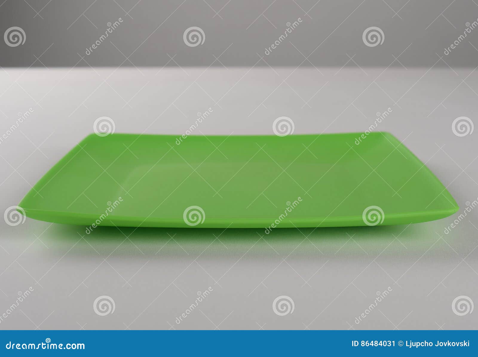 Green plastic shallow dish stock image. Image of shot - 86484031