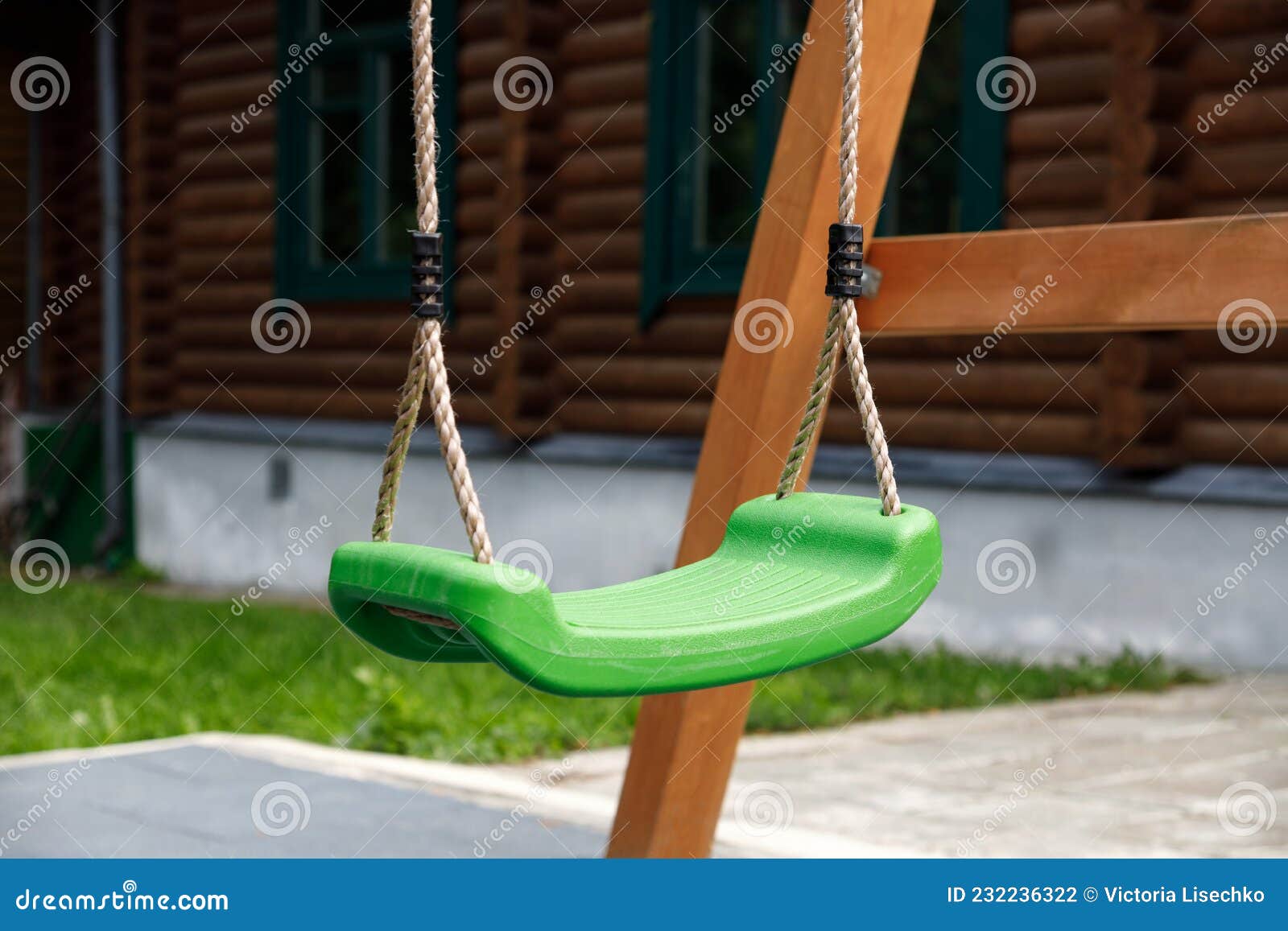 Green Plastic Swing on Ropes in the Yard Stock Photo - Image of yard ...
