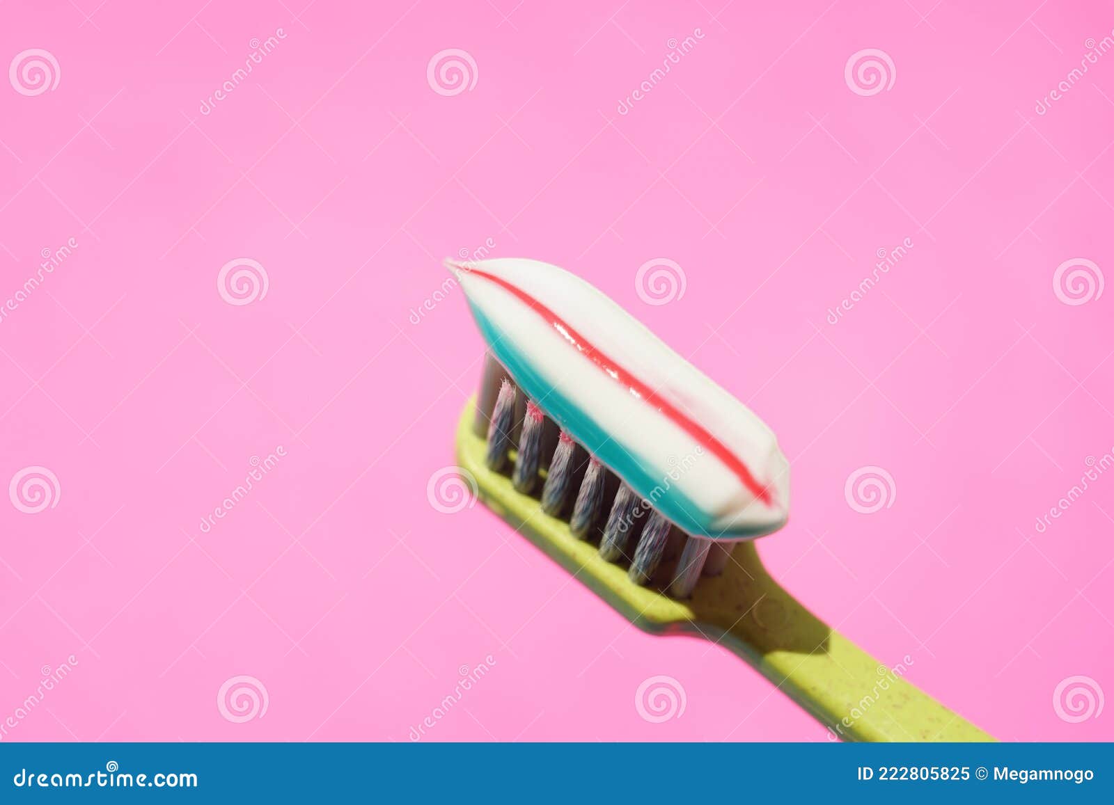 Green Plastic Toothbrush with Striped Toothpaste on Pink Background ...