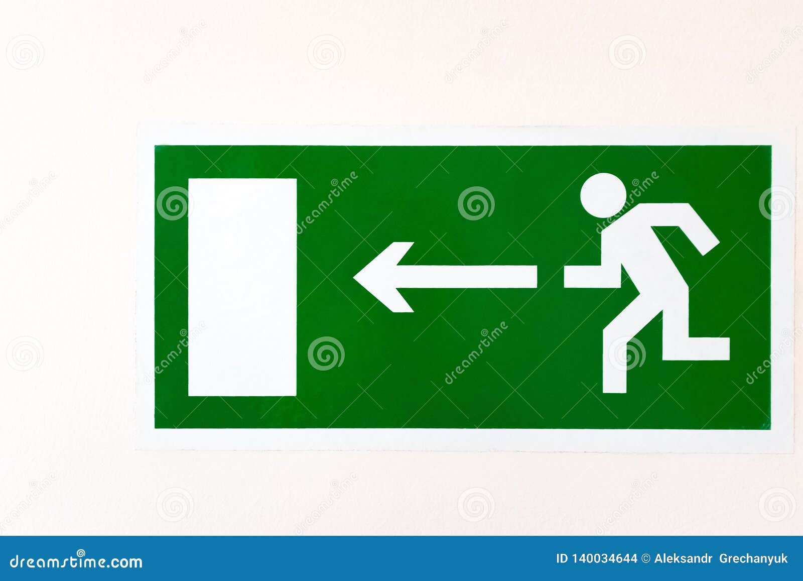 A Green Poster DIRECTION TO EVACUATION EXIT LEFT Stock Photo - Image of ...