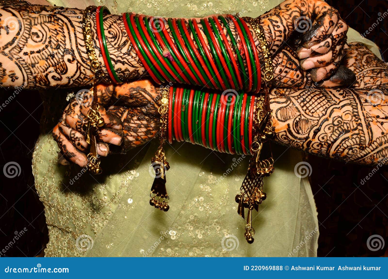 Green Red Bengals in Woman Hand Stock Photo - Image of bengals, cloth ...