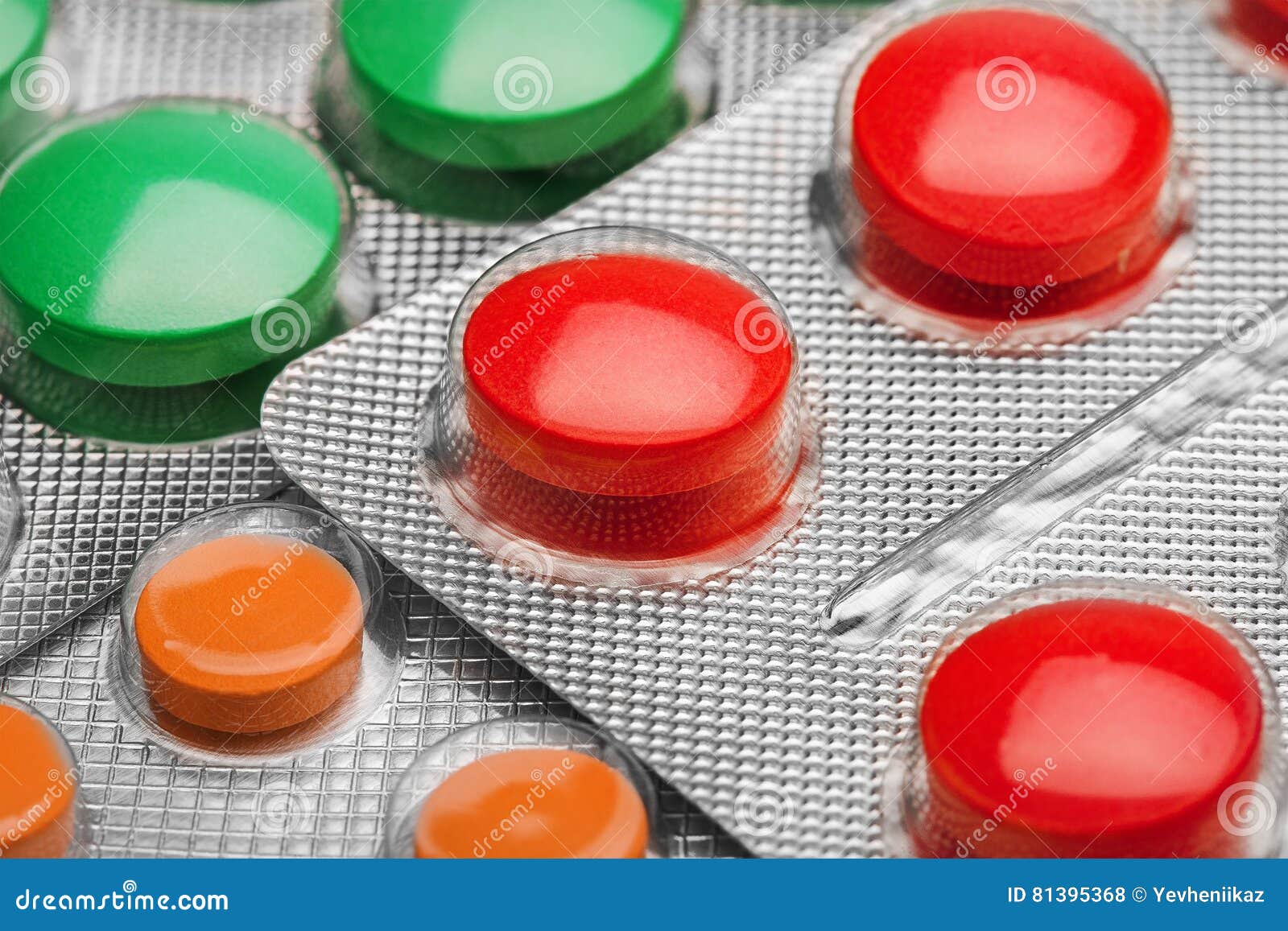 Green, Red and Orange Medical Pills in Plastic Packaging Silver Stock ...